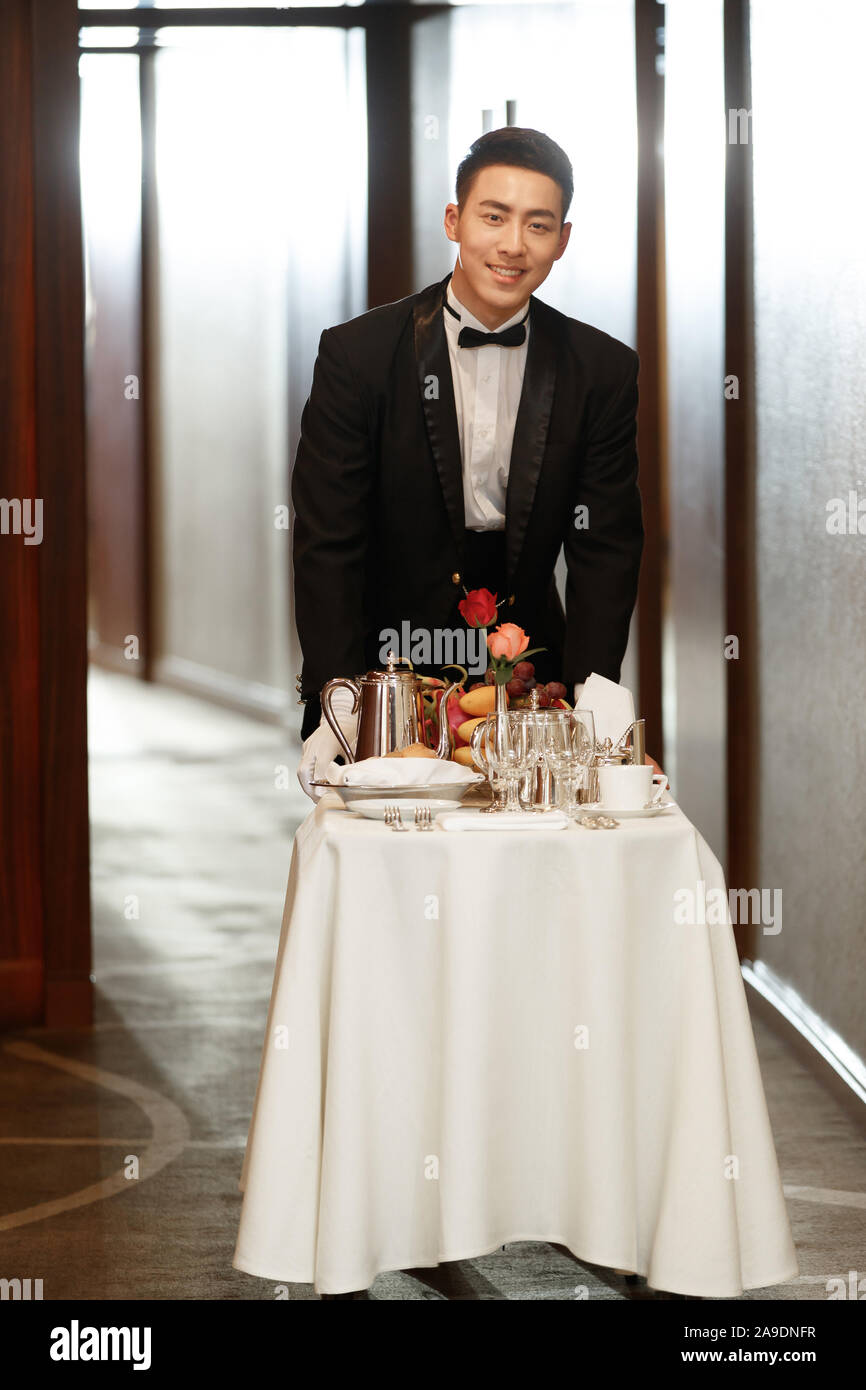The hotel waiter Stock Photo - Alamy