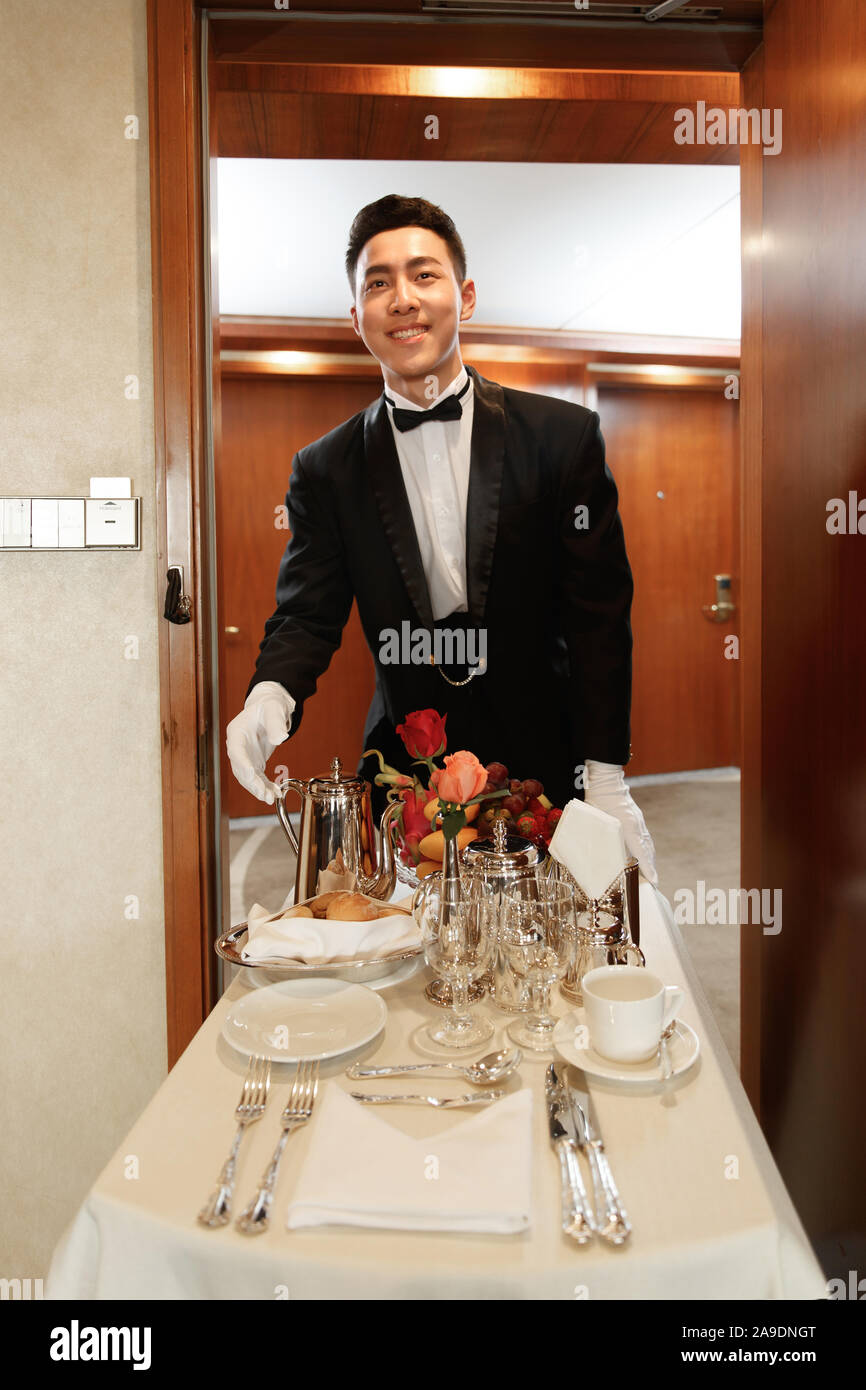 The hotel waiter Stock Photo - Alamy