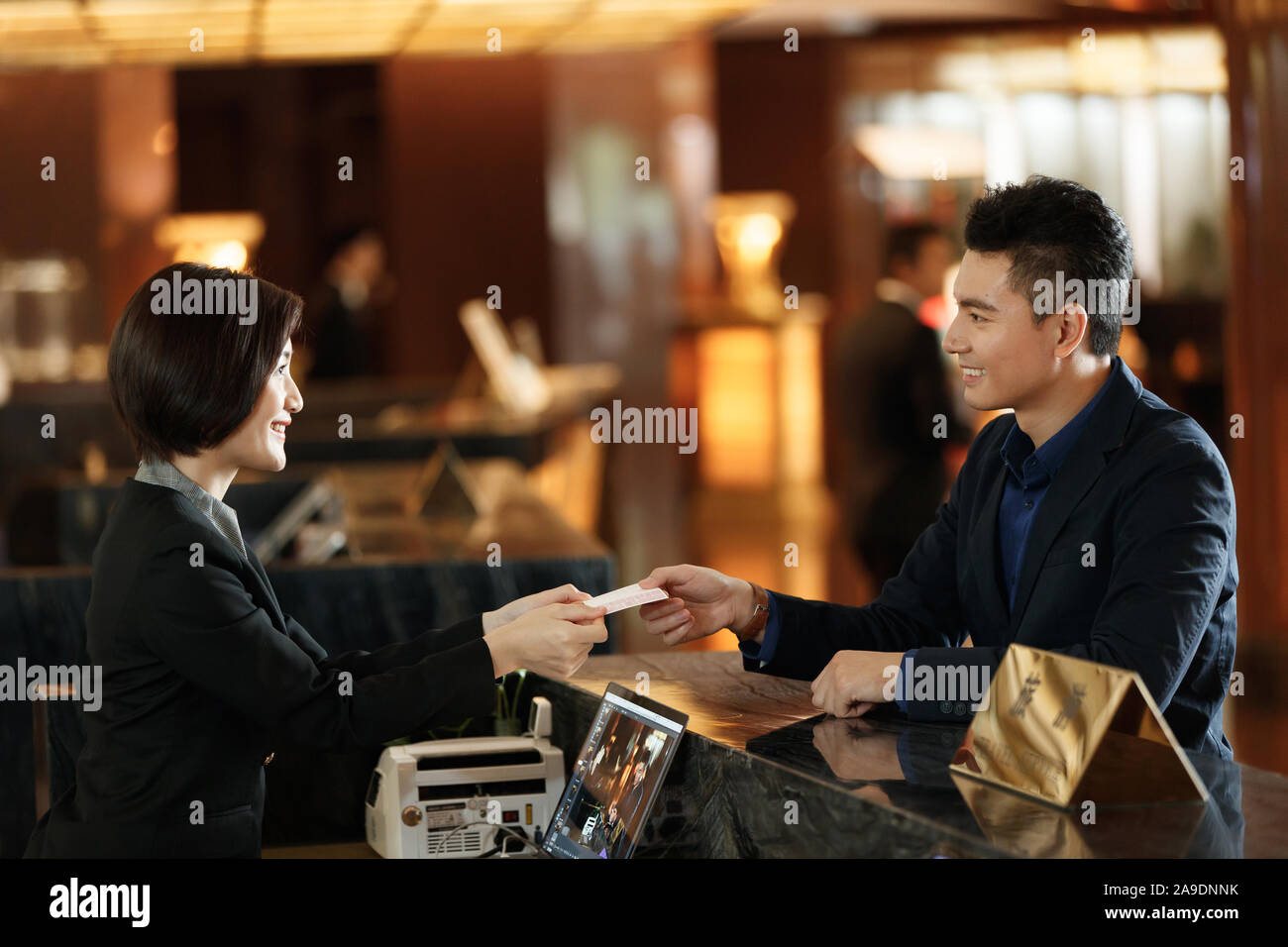 Business man for hotel registration Stock Photo - Alamy
