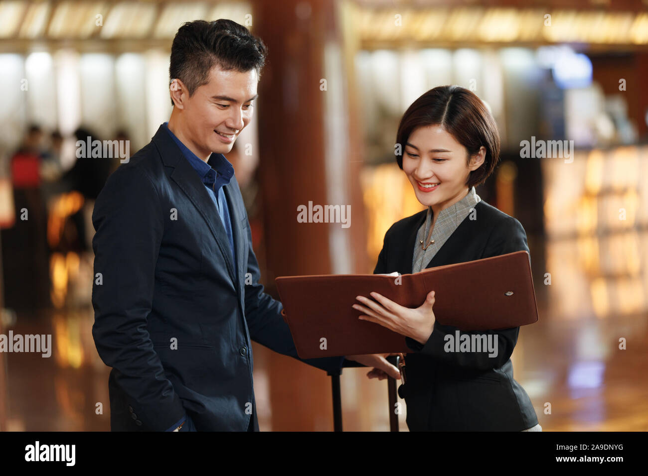 Business man for hotel registration Stock Photo - Alamy
