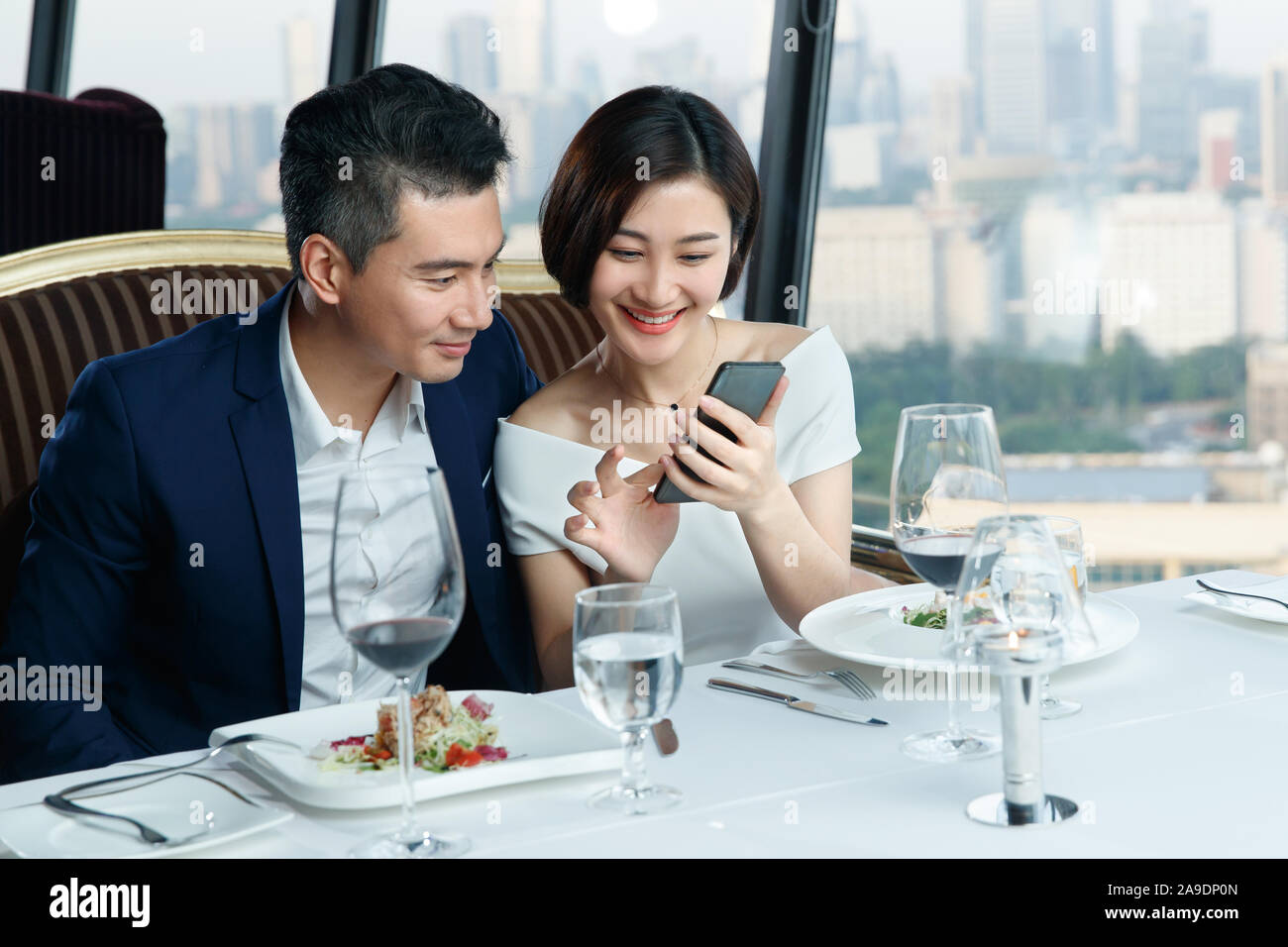 Young couples in the restaurant Stock Photo - Alamy