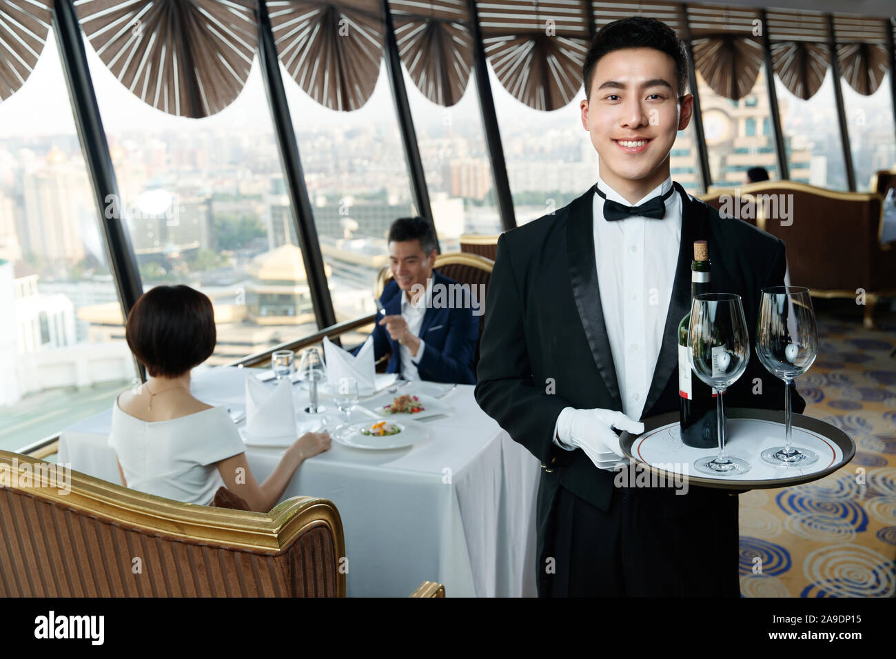 Hotel waiter and customer Stock Photo - Alamy