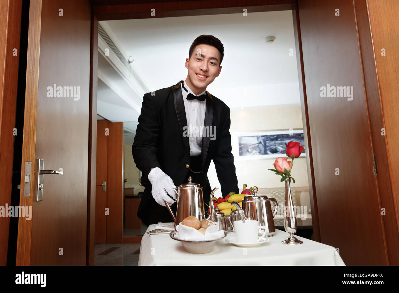 The hotel waiter Stock Photo - Alamy