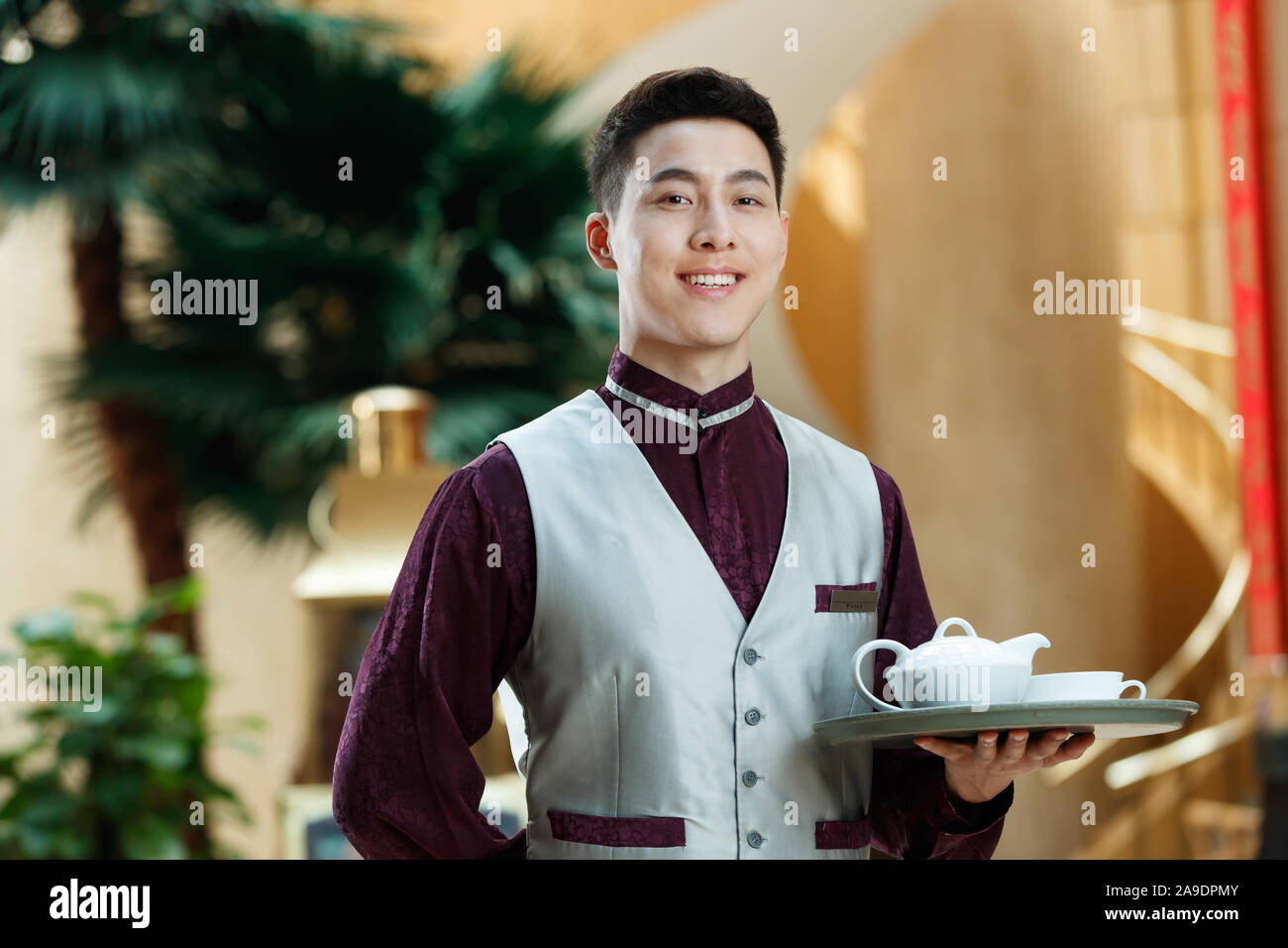 The hotel waiter Stock Photo - Alamy