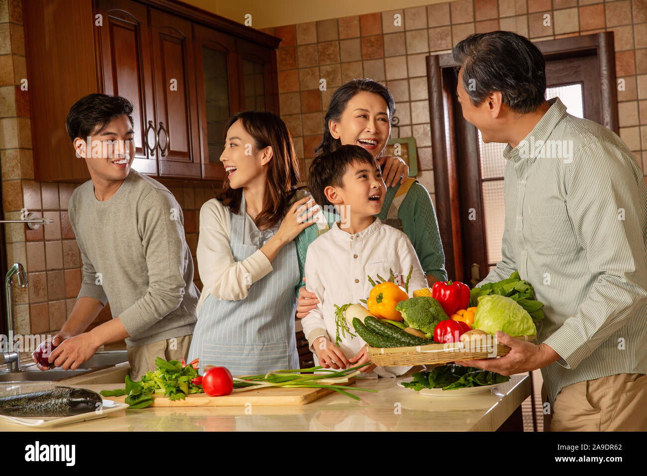 A happy family is cooking in the kitchen Stock Photo - Alamy