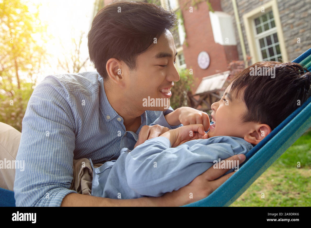 Indian father son back back hi-res stock photography and images - Alamy