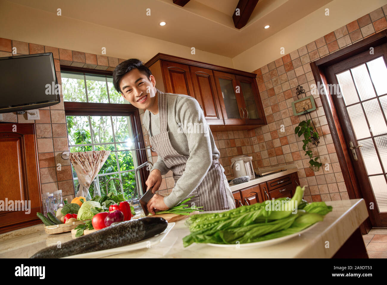 Asian men cooking hi-res stock photography and images - Alamy