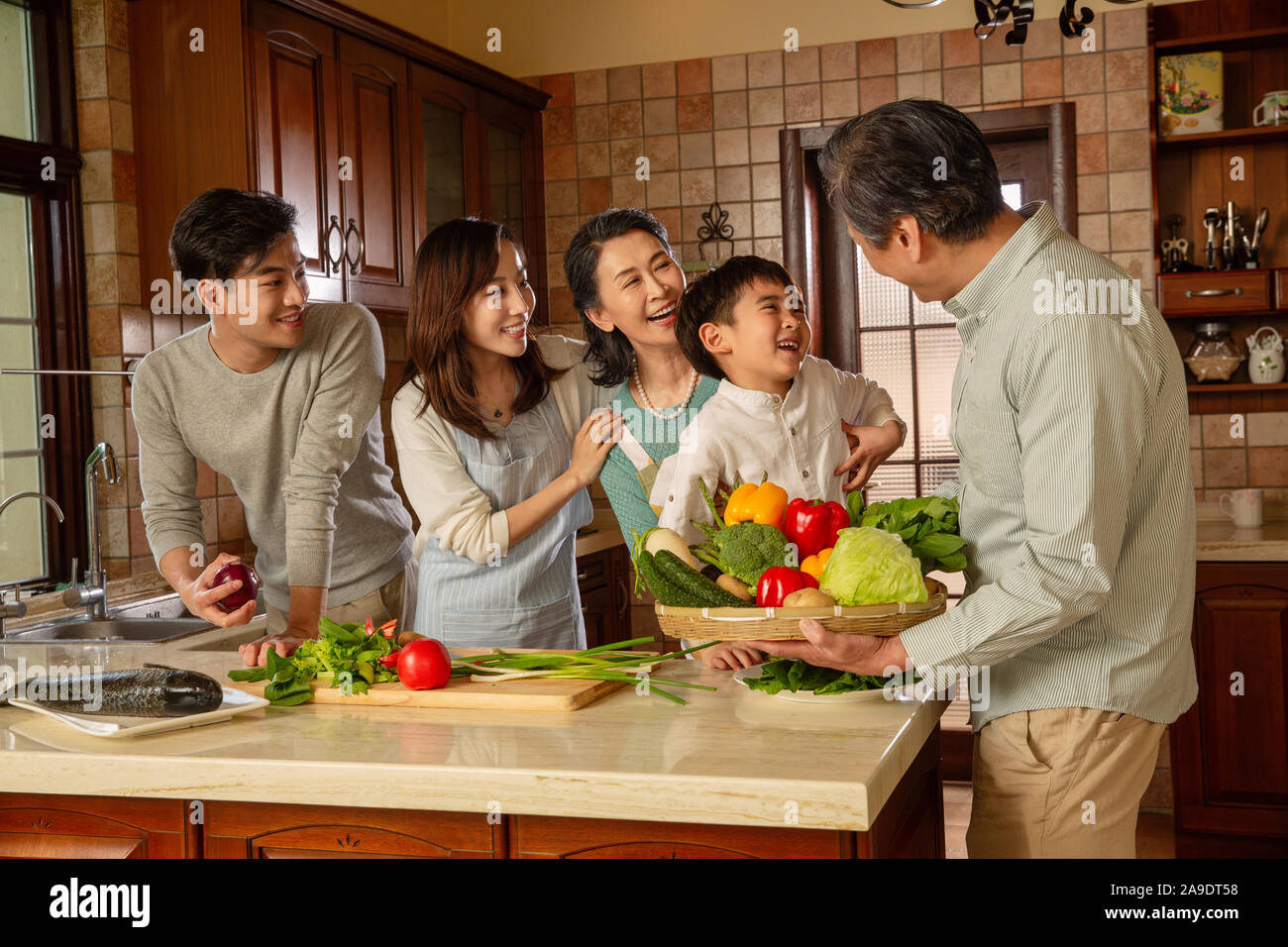 A happy family is cooking in the kitchen Stock Photo - Alamy