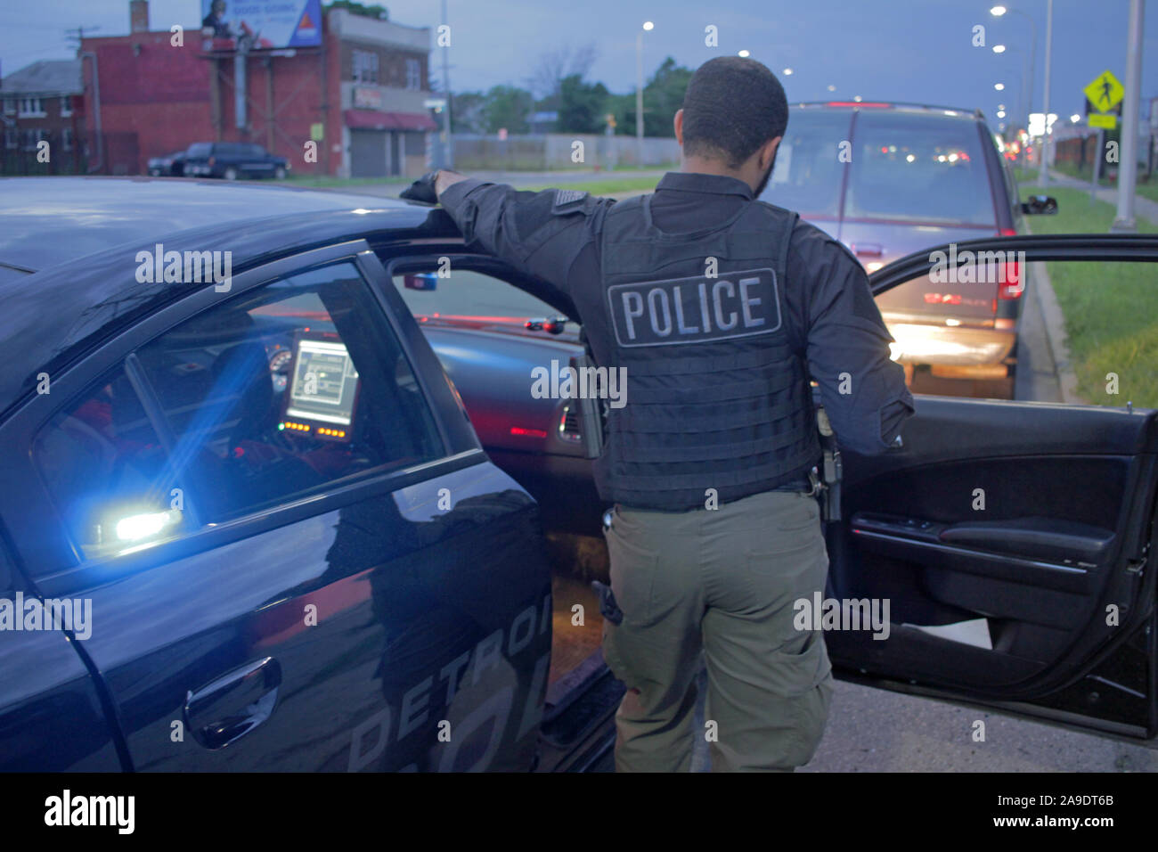 Detroit police officer checks a van in Detroit, Michigan, USA Stock ...