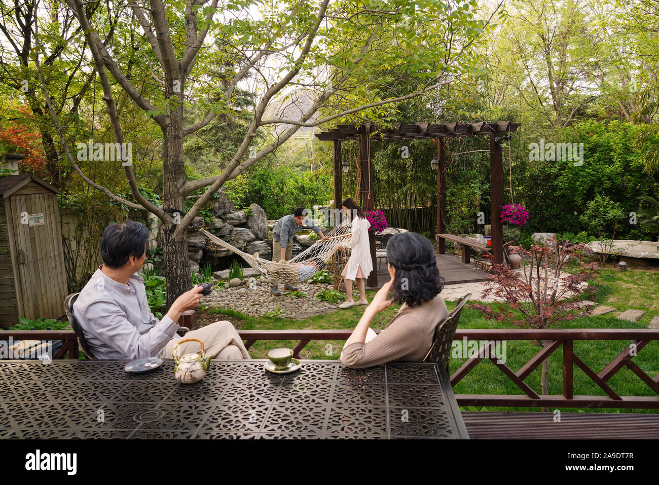Happy family playing in the courtyard Stock Photo - Alamy