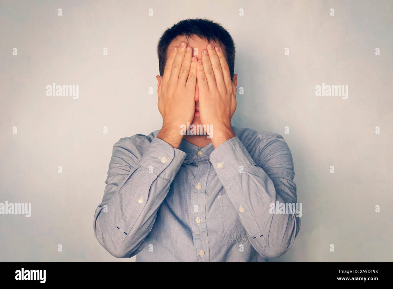 Businessman covers his face with hands. Fatigue and stress at work. The ...