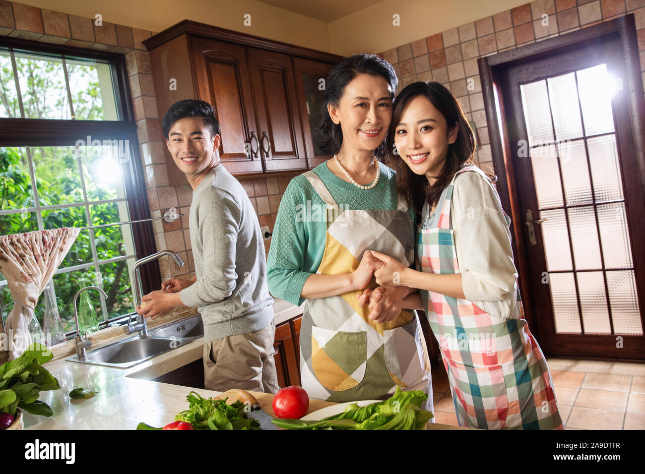 A happy family is cooking in the kitchen Stock Photo - Alamy