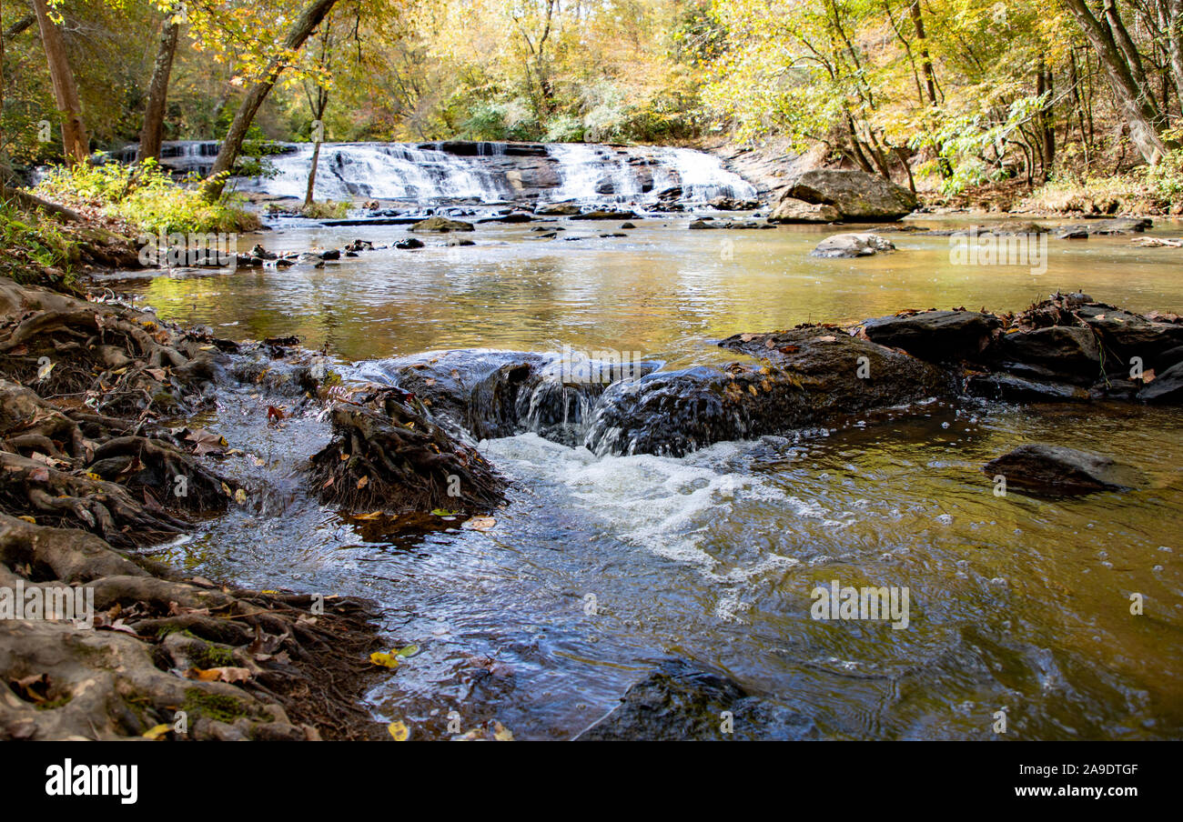 waterfall in autumn showing eddy Stock Photo - Alamy