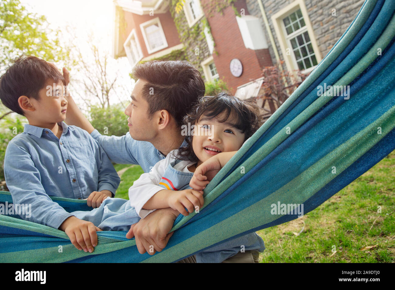 Father and children playing in the yard Stock Photo - Alamy