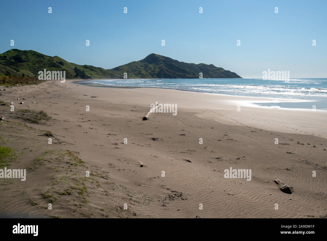 Clean pristine and empty beach leading to the promontory Stock Photo ...