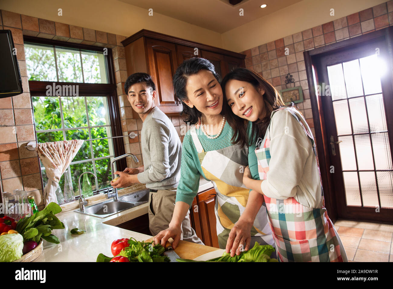 A happy family is cooking in the kitchen Stock Photo - Alamy