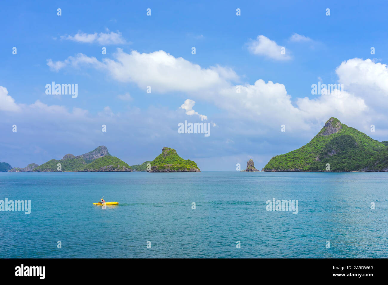 Tourist kayaking in blue Idyllic turquoise ocean to explore near the ...