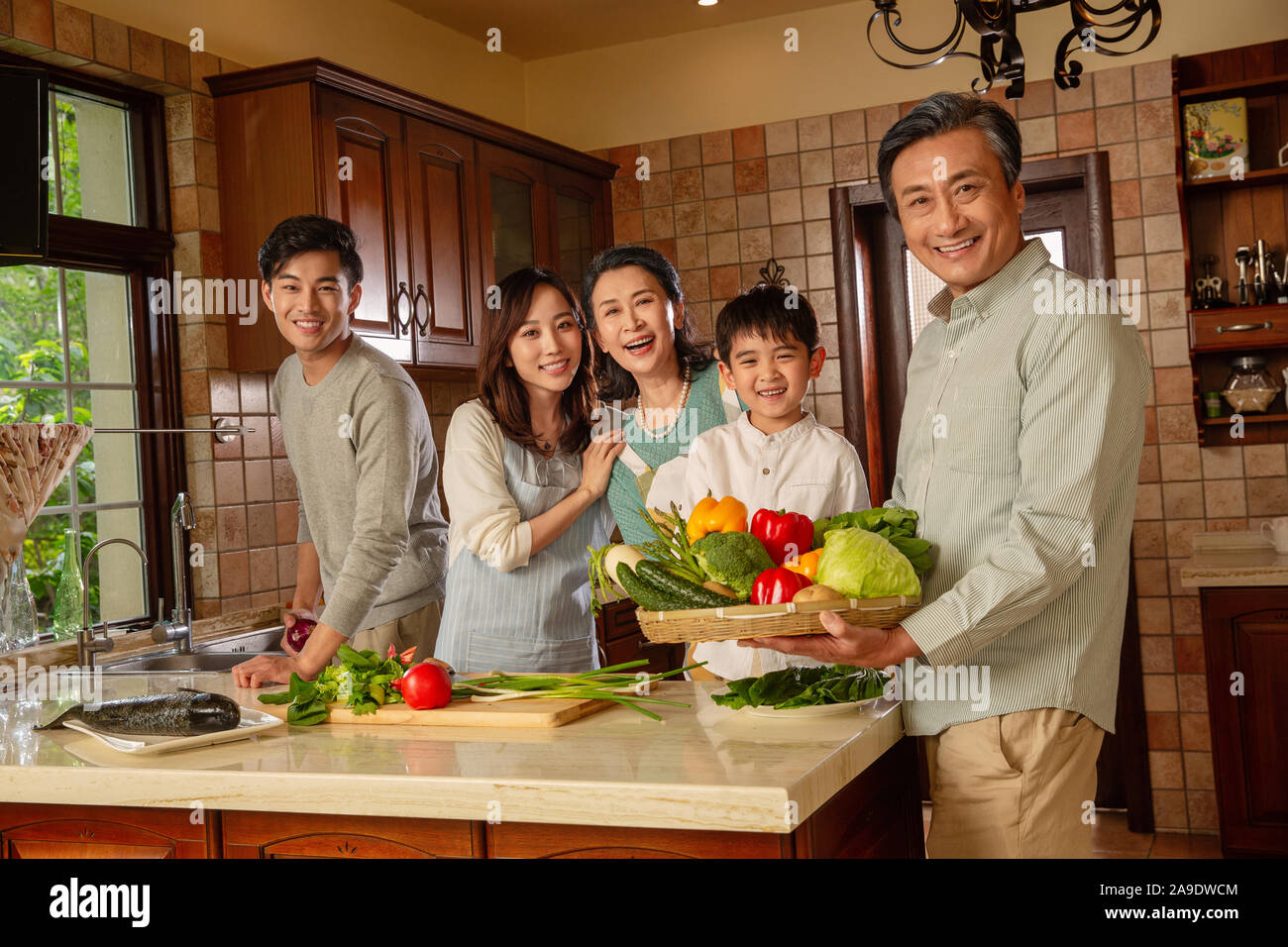 A happy family is cooking in the kitchen Stock Photo - Alamy