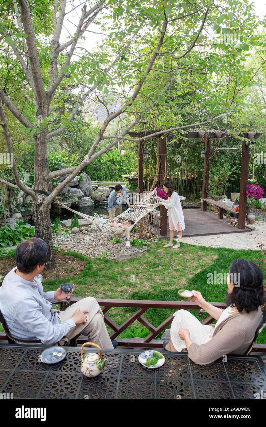 Happy family playing in the courtyard Stock Photo - Alamy