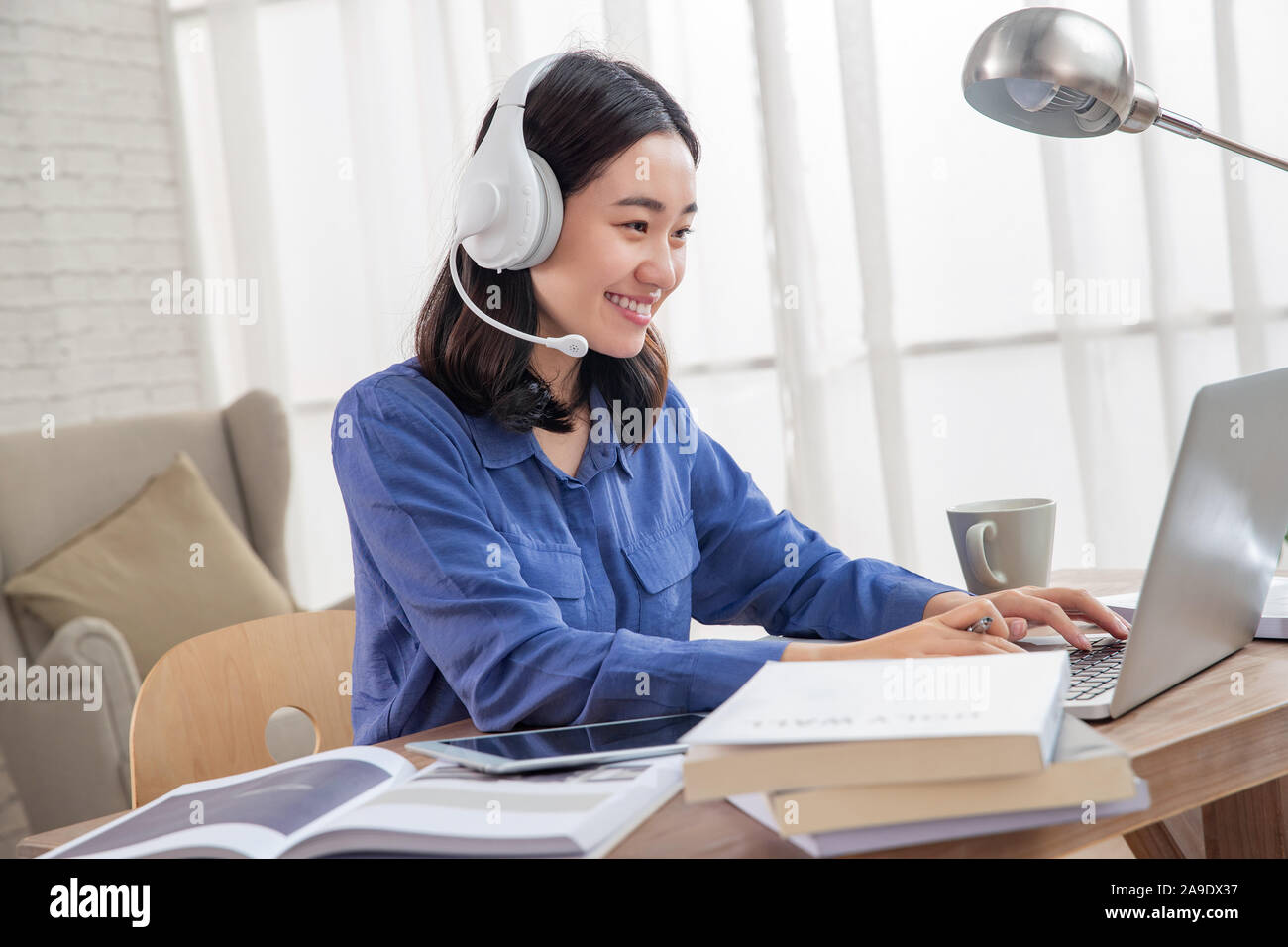 Young women online learning Stock Photo - Alamy