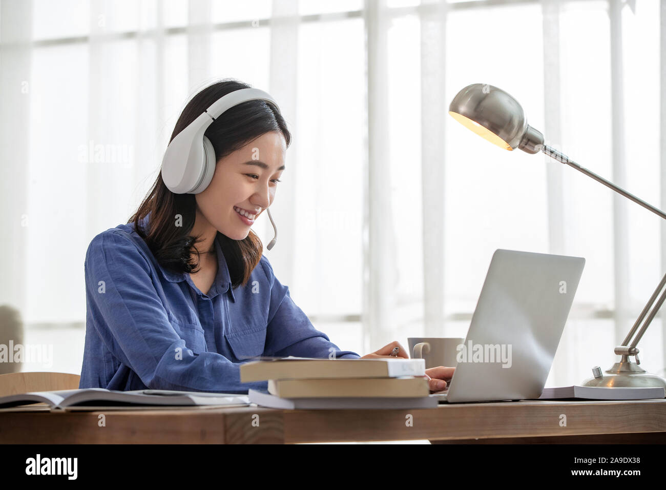 Young women online learning Stock Photo - Alamy
