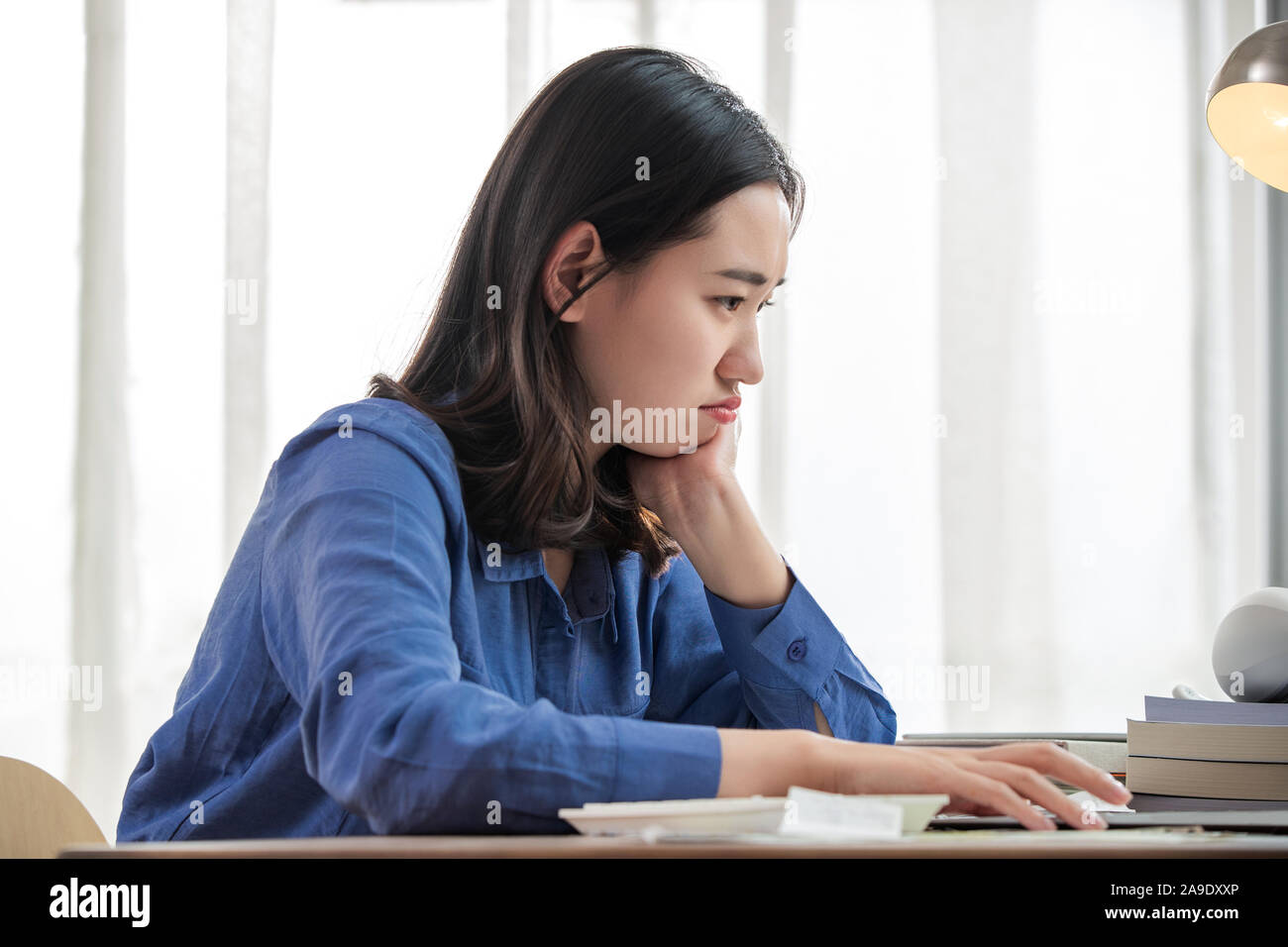 Young woman use the computer Stock Photo - Alamy