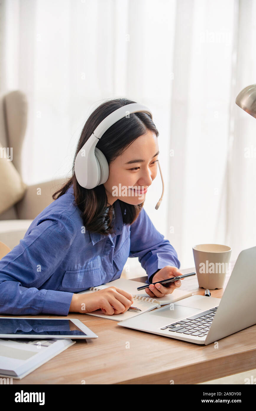 Young women online learning Stock Photo - Alamy