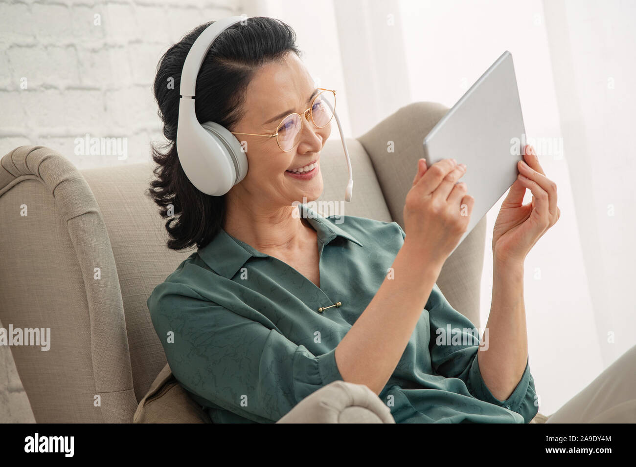 Old people use tablet computers Stock Photo - Alamy