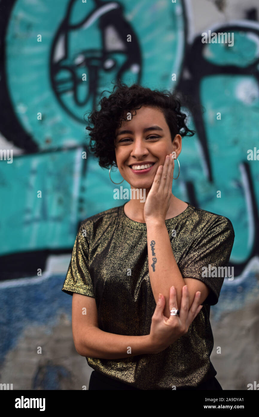 Smiling young latina woman looking at camera, Cali, Colombia Stock ...
