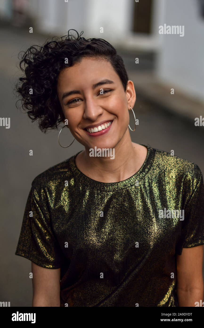 Smiling young latina woman looking at camera, Cali, Colombia Stock ...