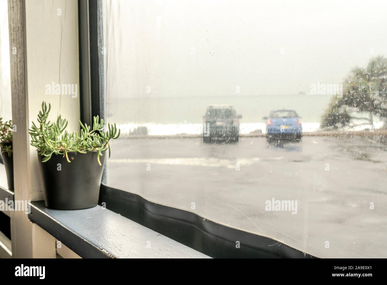 Window to the parking lot Stock Photo - Alamy