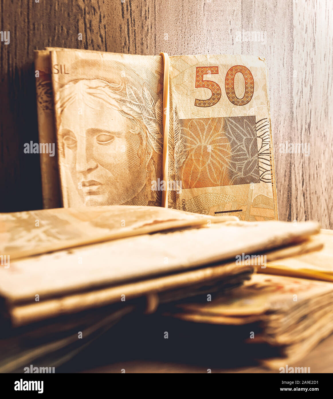 Brazilian Currency. Photo of a group of 50 reais notes on wooden ...