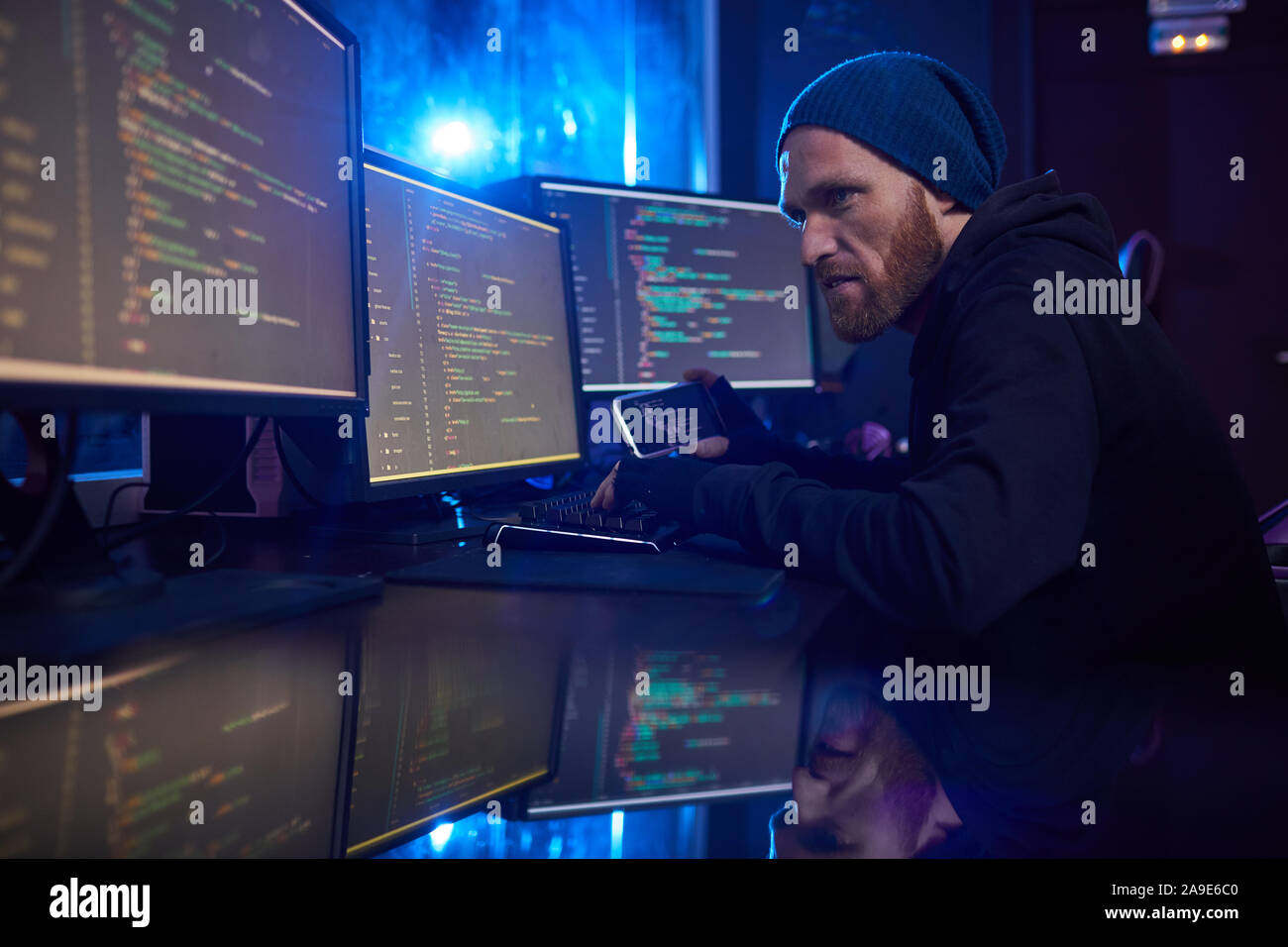 Security man looking at monitors hi-res stock photography and images ...