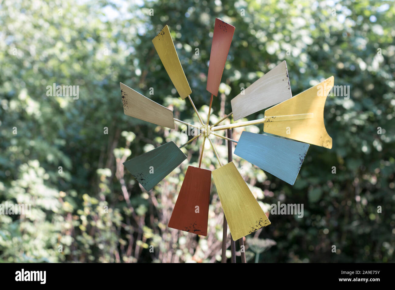 Coloured wind mill in the garden Stock Photo - Alamy