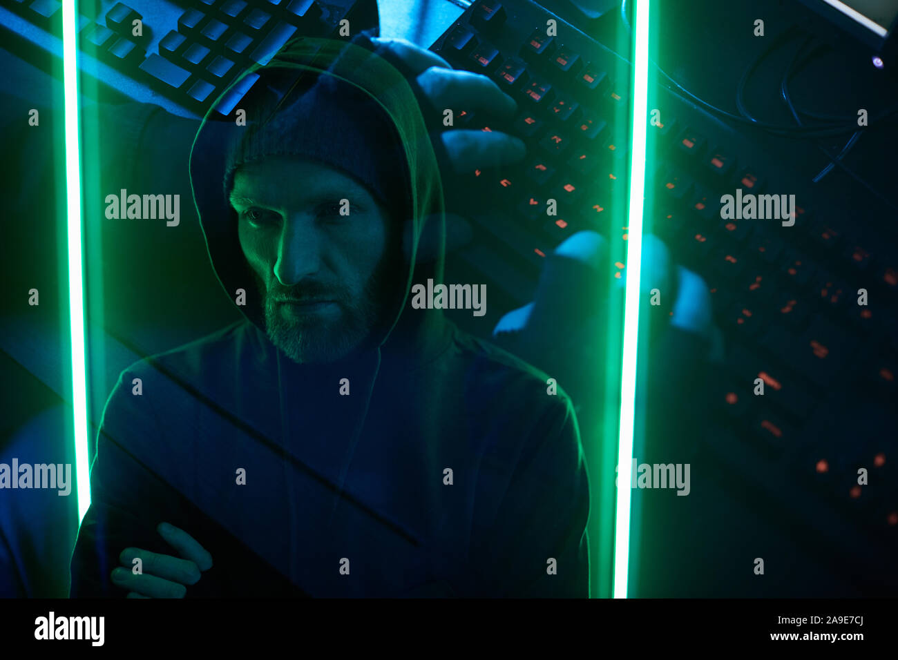 Computer hacker standing and remembering the password from computer ...