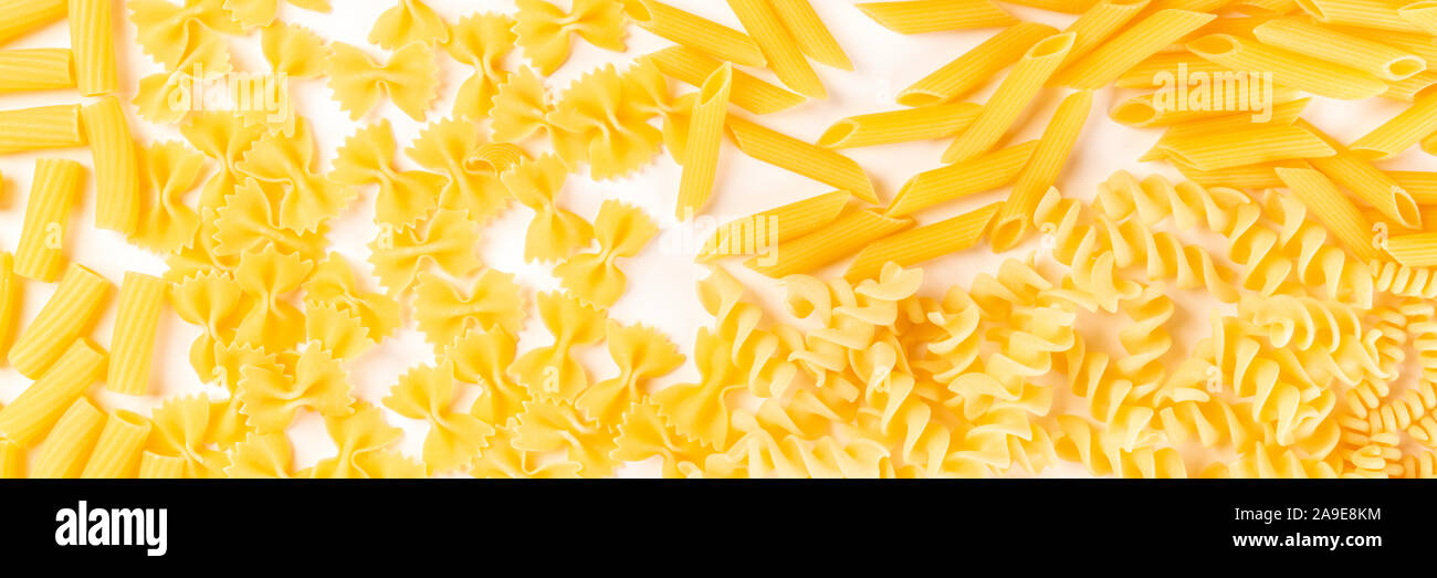 Italian pasta panorama, a flat lay texutre on a white background ...