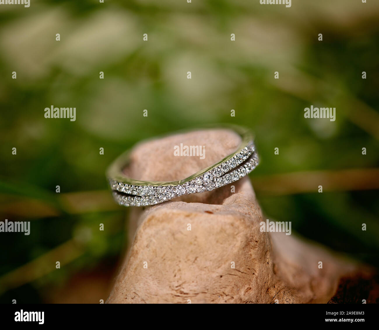 Diamond wedding ring in cross over design Stock Photo - Alamy