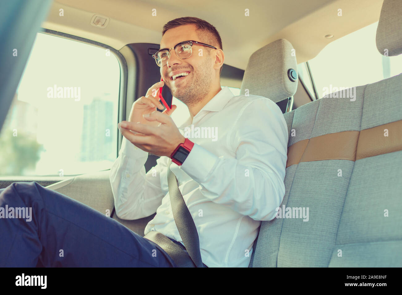 Positive delighted man having pleasant telephone conversation Stock ...