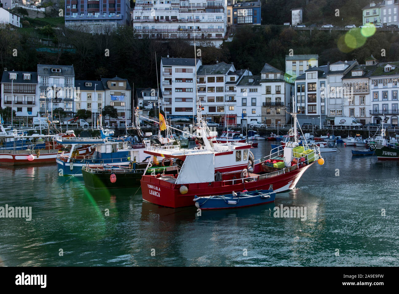 Coloured fishing boats in the harbour of Luarca, Asturias, Costa Brava ...