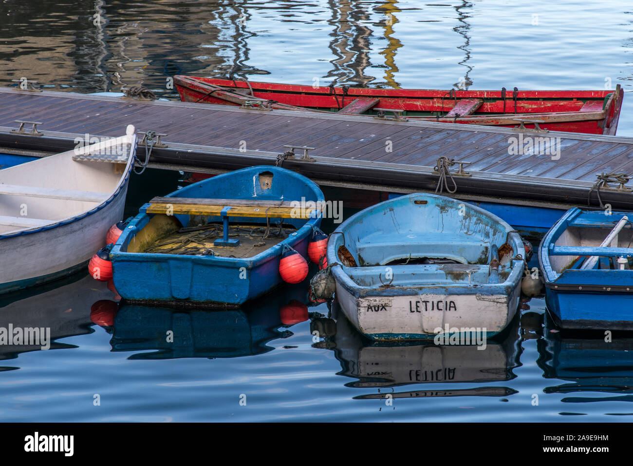 Coloured fishing boats in the harbour of Luarca, Asturias, Costa Brava ...