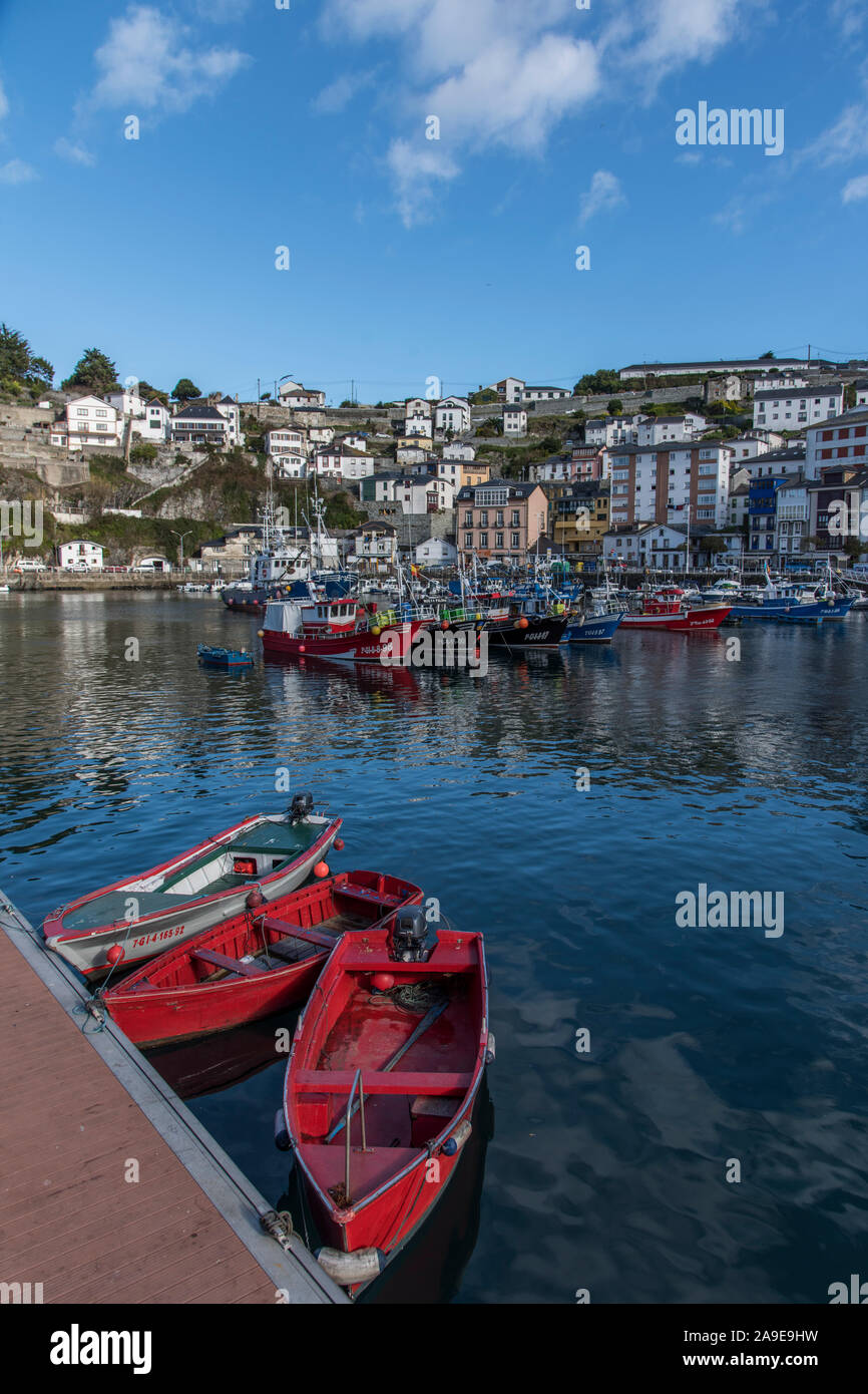 Coloured fishing boats in the harbour of Luarca, Asturias, Costa Brava ...