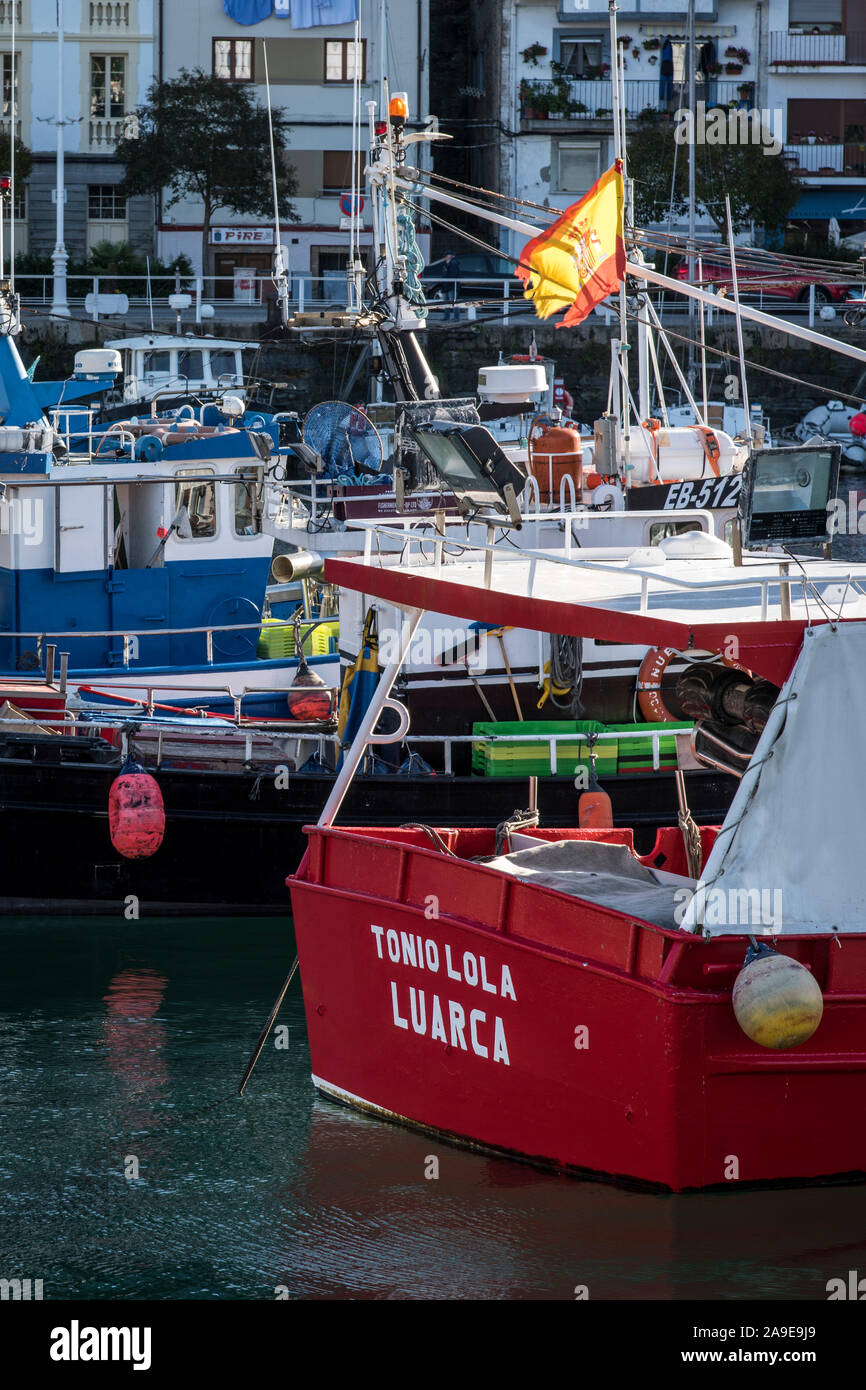 Coloured fishing boats in the harbour of Luarca, Asturias, Costa Brava ...