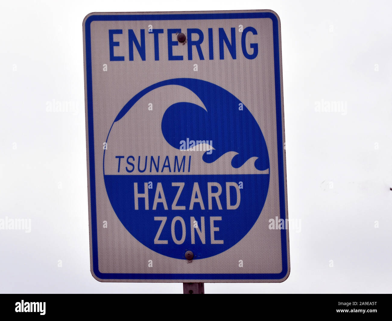 A sign warning that this area is a tsunami hazard zone Stock Photo - Alamy