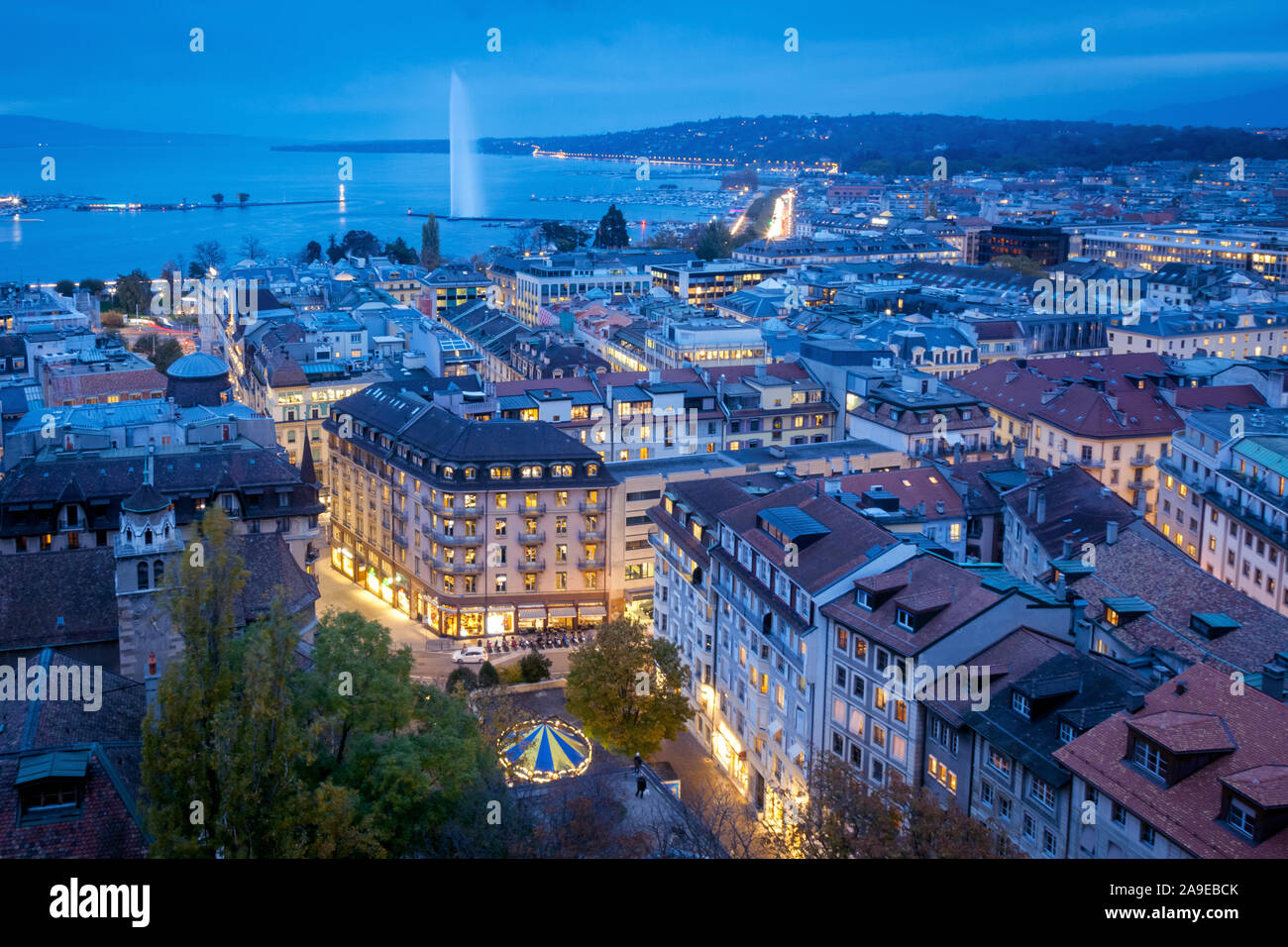 Aerial view of Geneva City center and Jet d'eau by night. This photo ...