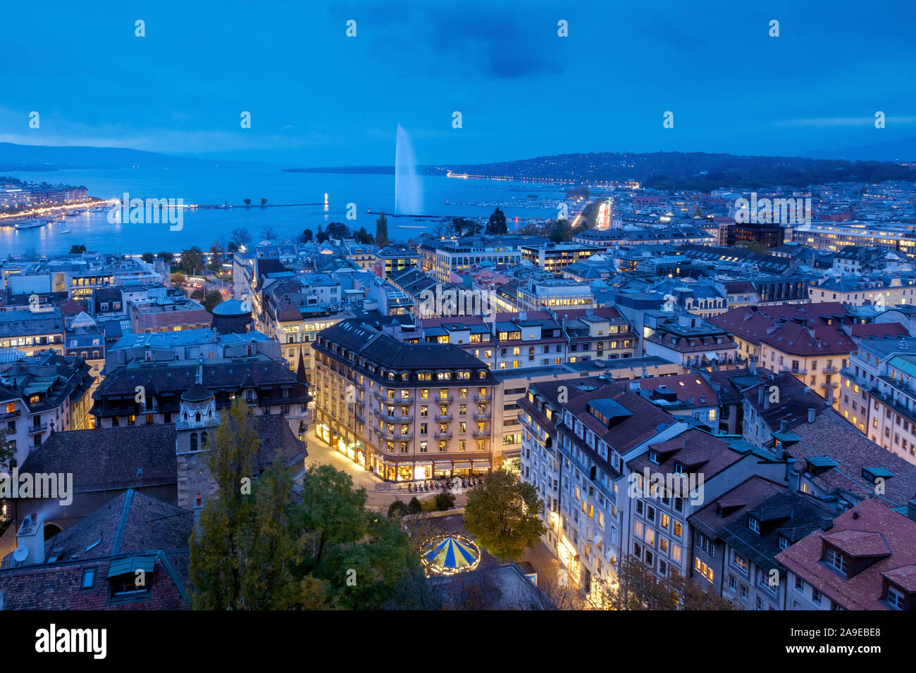 Aerial view of Geneva City center and Jet d'eau by night. This photo ...