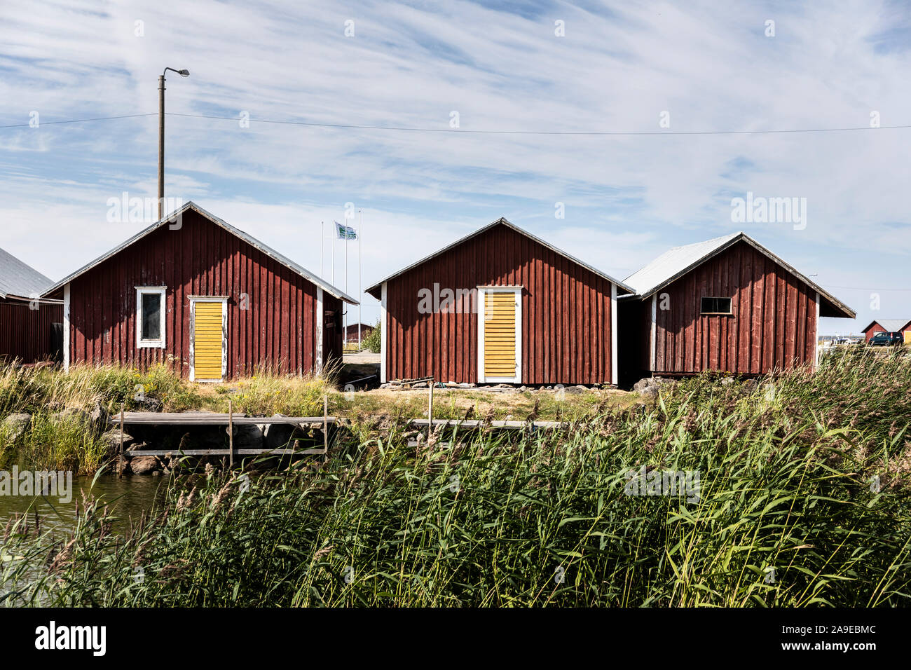 Finland, Kvarken, Björkö, Svedjehamn, wooden huts in the harbour Stock ...