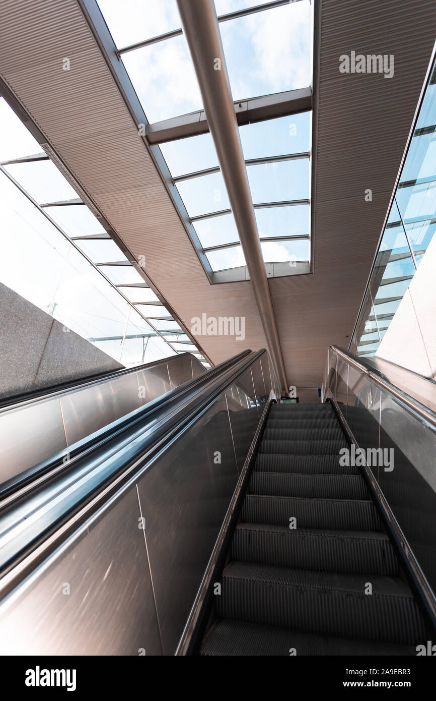 The escalator rises up the street Stock Photo - Alamy