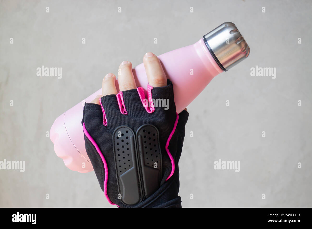 Fitness glove hand on water bottle, stock photo Stock Photo - Alamy