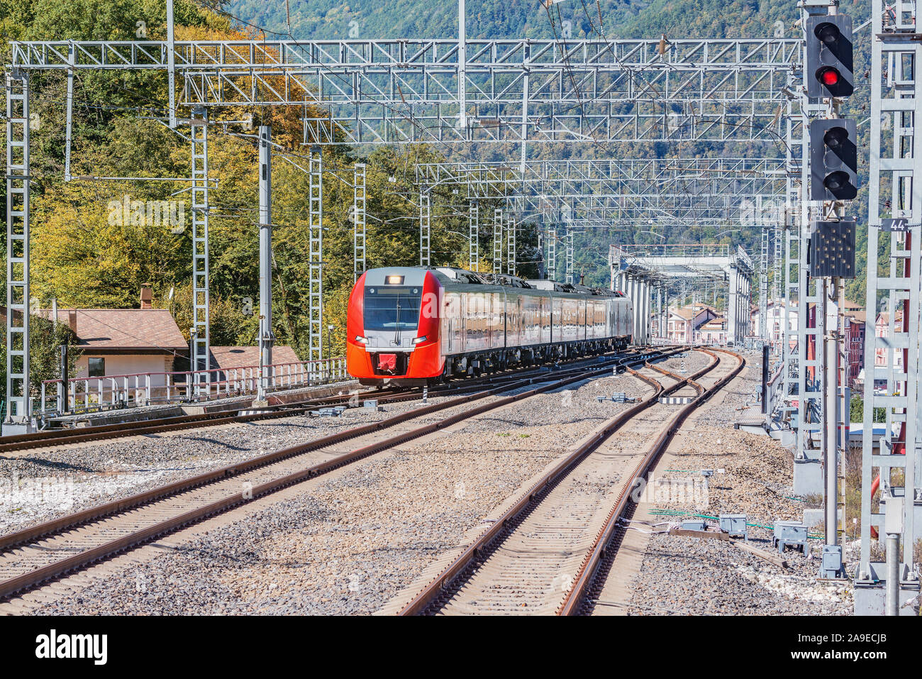 Passenger train approach to Roza Khutor railway station. Caucasus ...