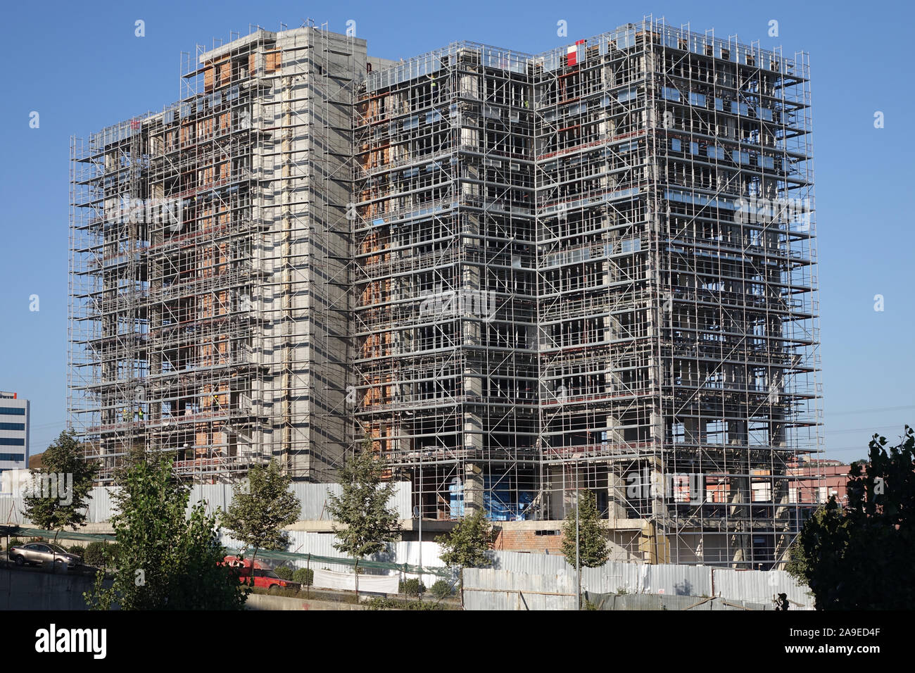 Single flat construction with blue sky Stock Photo - Alamy